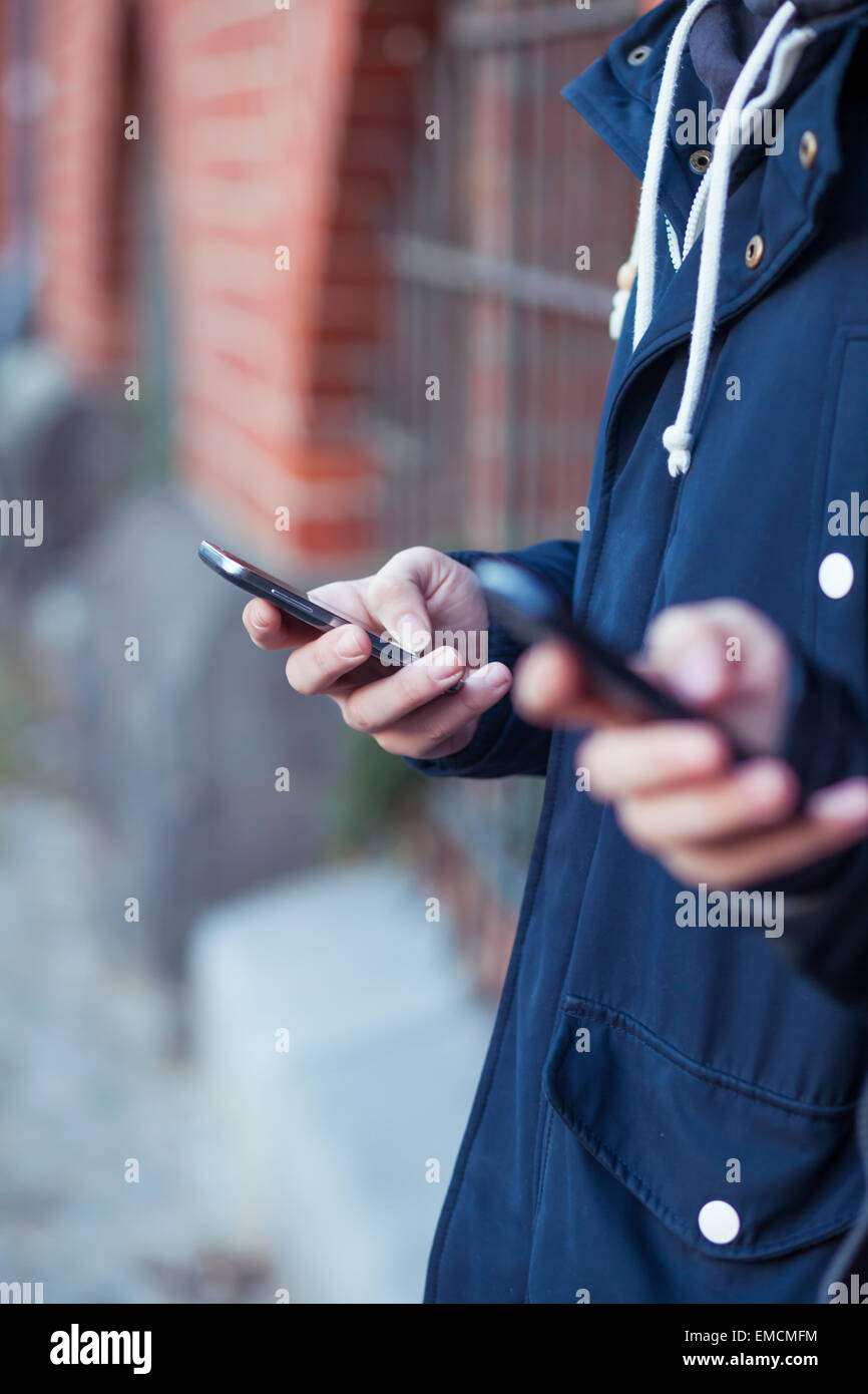 Hand of teenage boy with smartphone Stock Photo - Alamy
