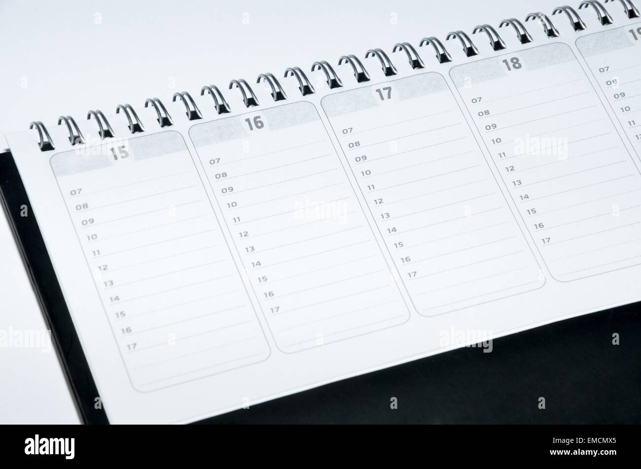 Rustic agenda with metal spiral and marked dates and hours Stock Photo ...