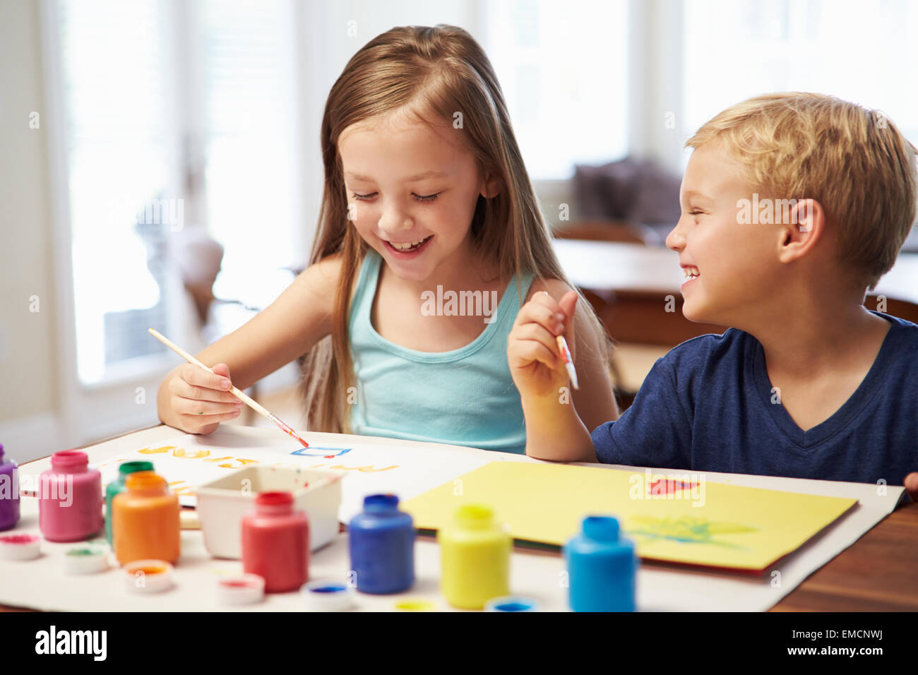 Two Children Painting Picture At Home Stock Photo - Alamy