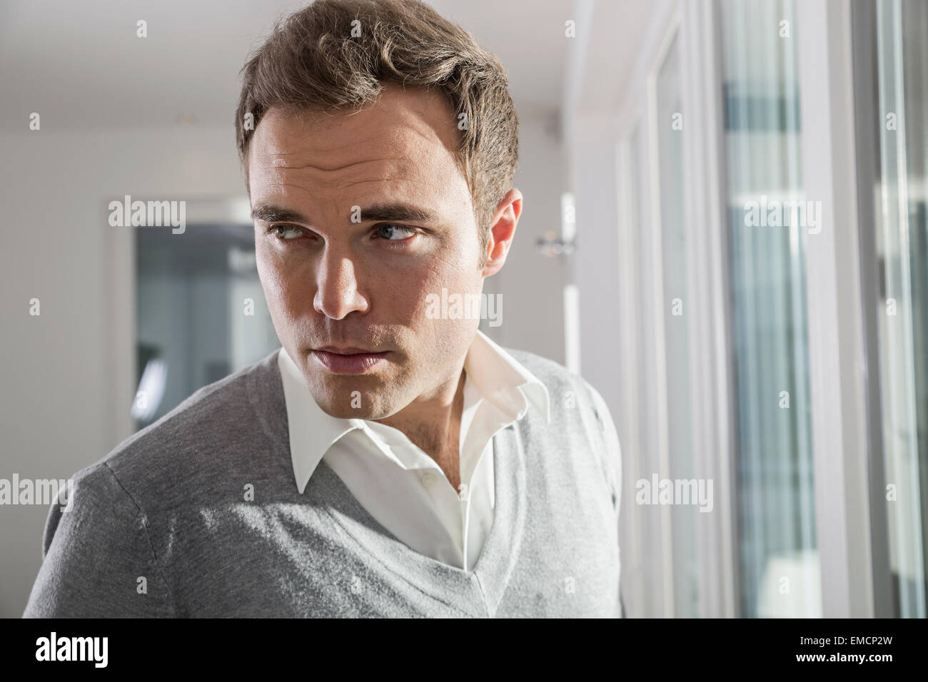 Portrait of man watching something Stock Photo - Alamy