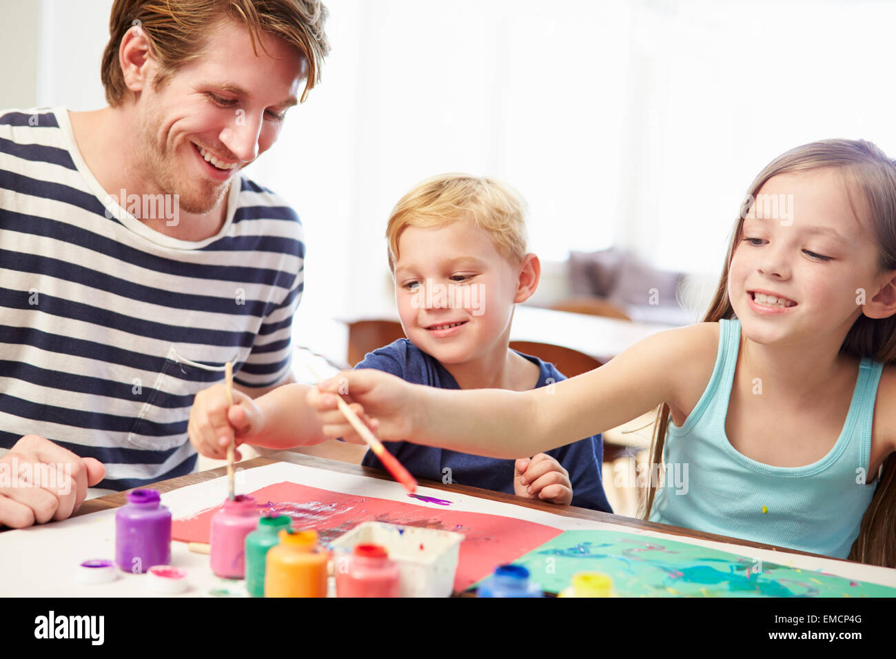 Father Painting Picture With Children At Home Stock Photo - Alamy