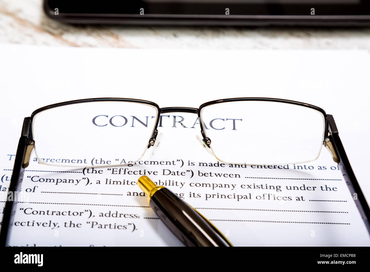 Reading a Contract before signing Stock Photo - Alamy