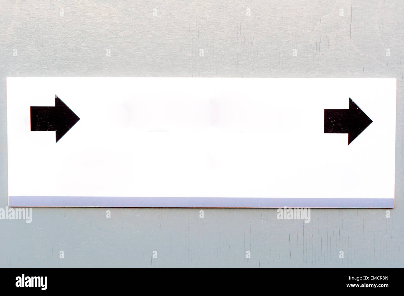 Route direction notice board on wooden background Stock Photo - Alamy