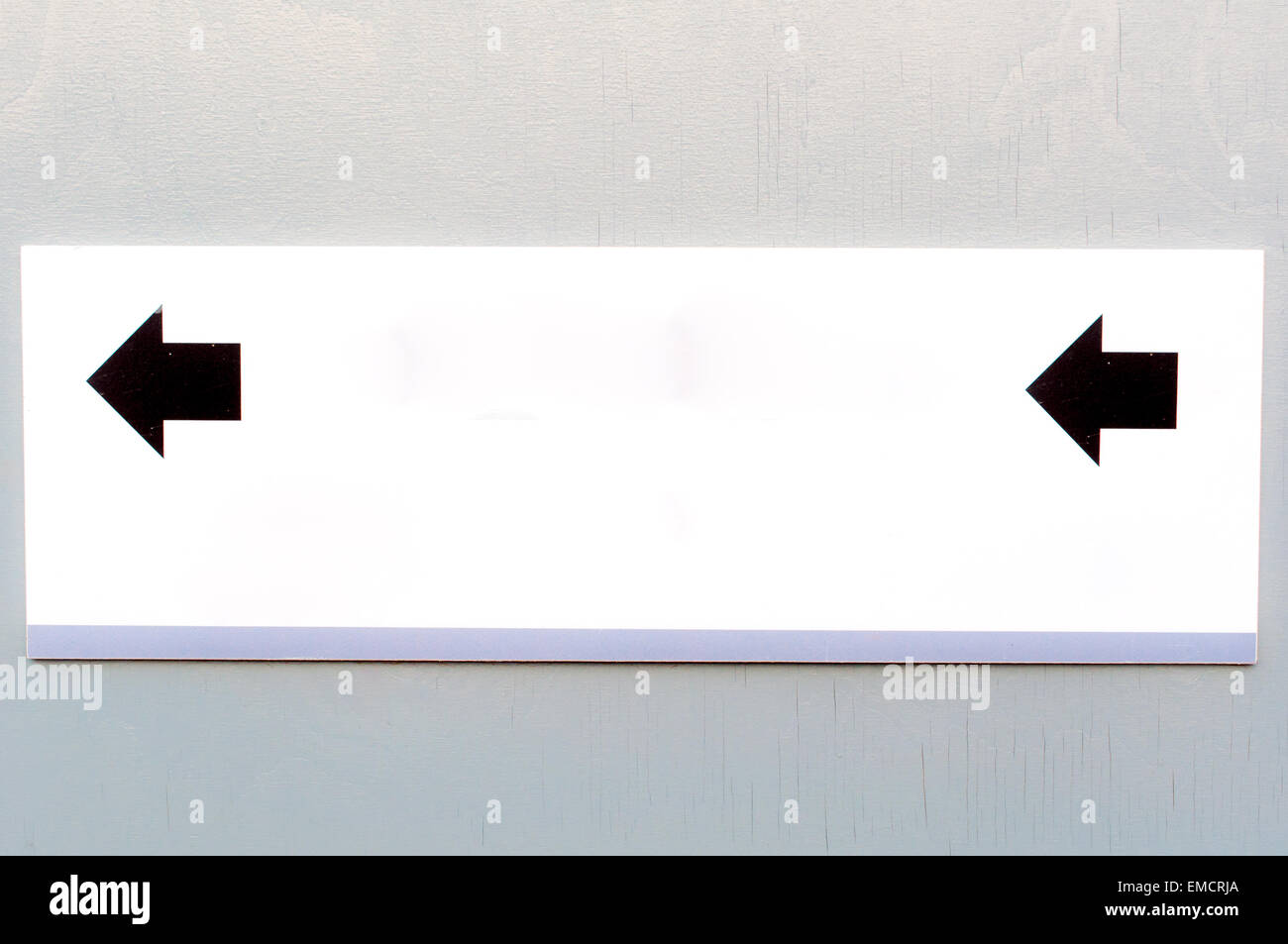 Route direction notice board on wooden background Stock Photo - Alamy