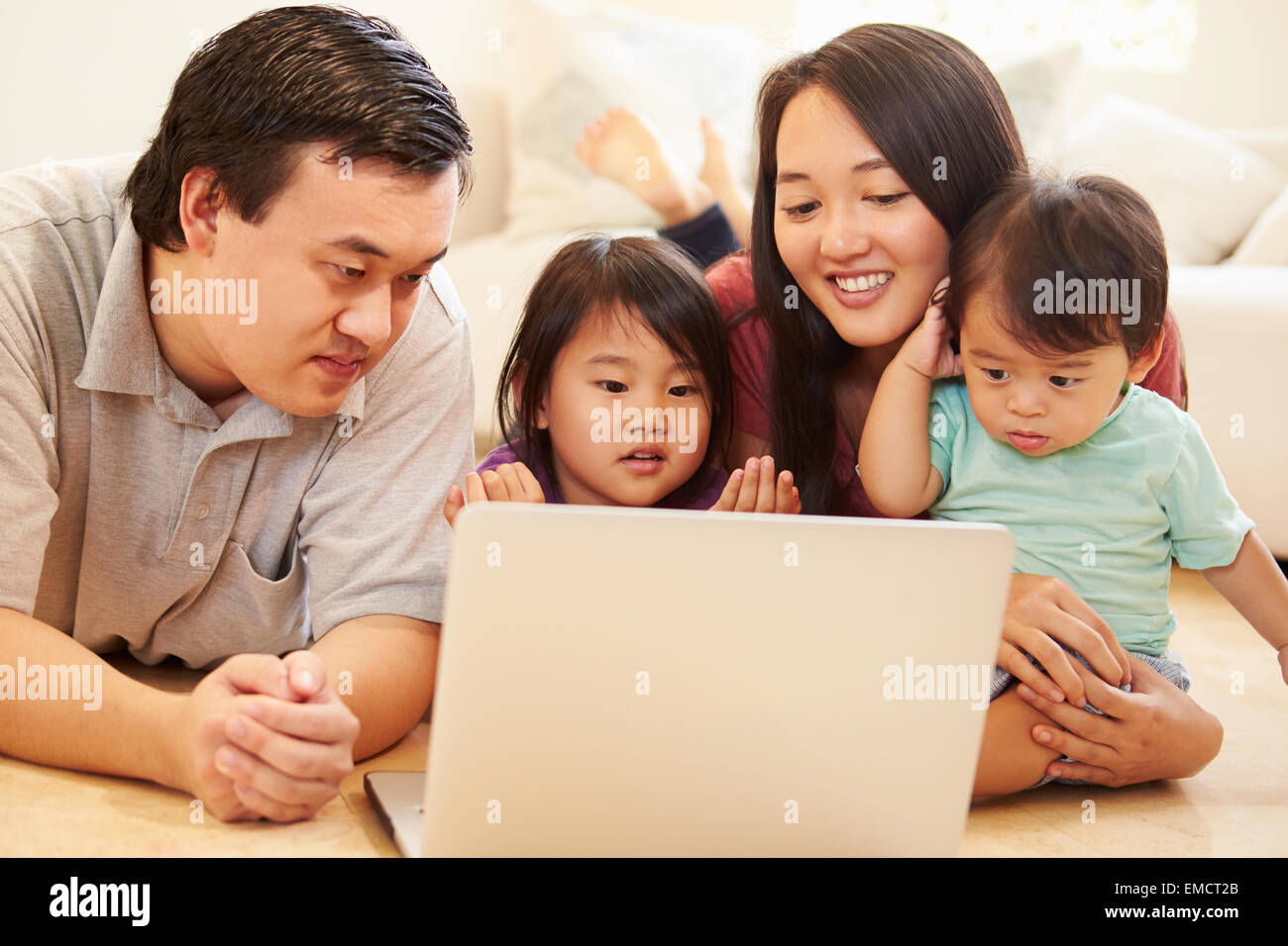 Family Watching Movie On Laptop At Home Stock Photo - Alamy