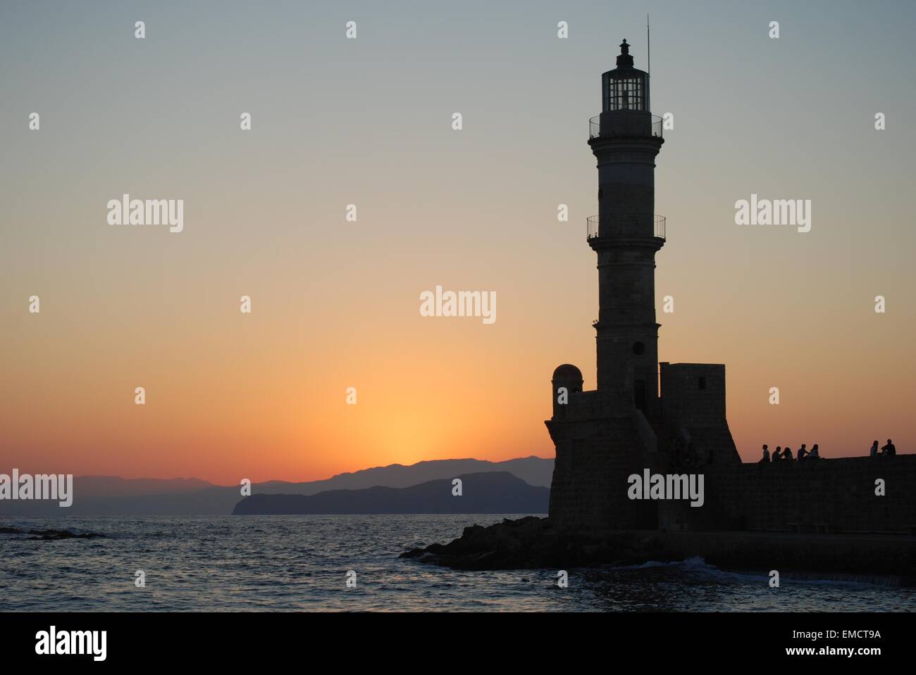 Chania lighthouse at sunset, Crete, Greece Stock Photo - Alamy