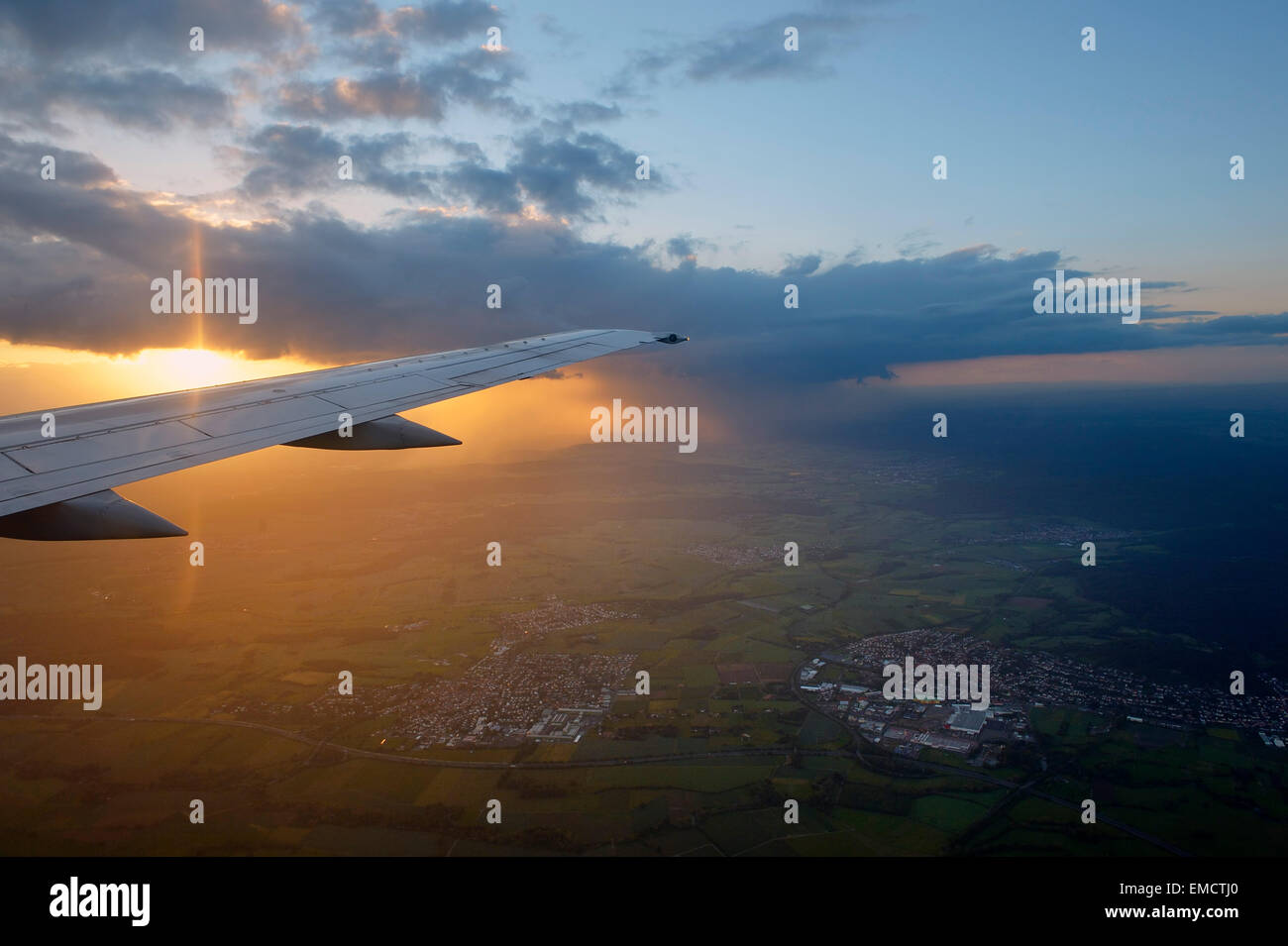 Germany, wing of an airplane with clouds at sunset Stock Photo - Alamy
