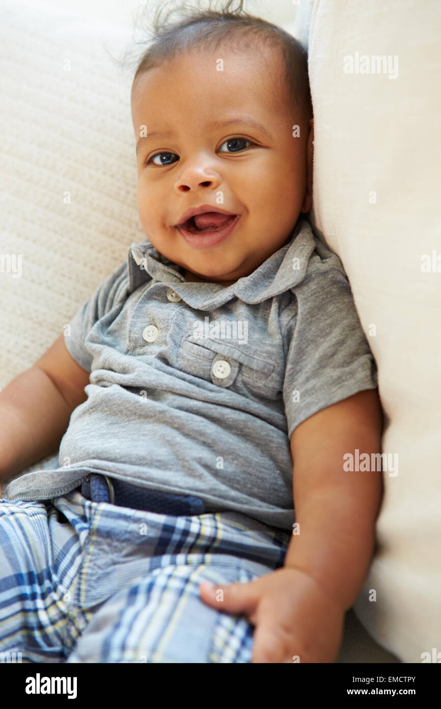 Smiling Baby Boy Lying On Back At Home Stock Photo - Alamy
