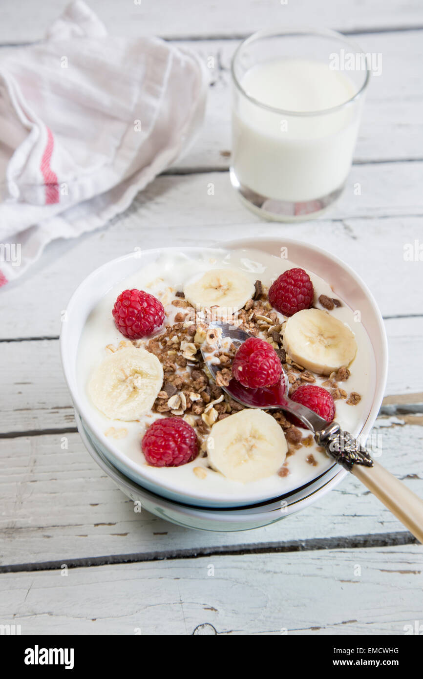 Yoghurt with muesli, raspberries and bananas Stock Photo - Alamy