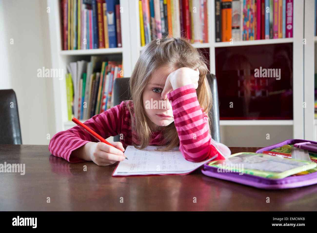 Frustrated girl doing homework Stock Photo - Alamy