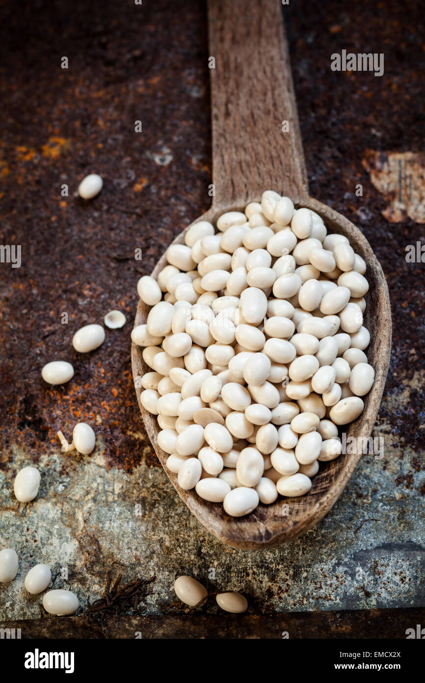 Wooden spoon of white beans Stock Photo - Alamy