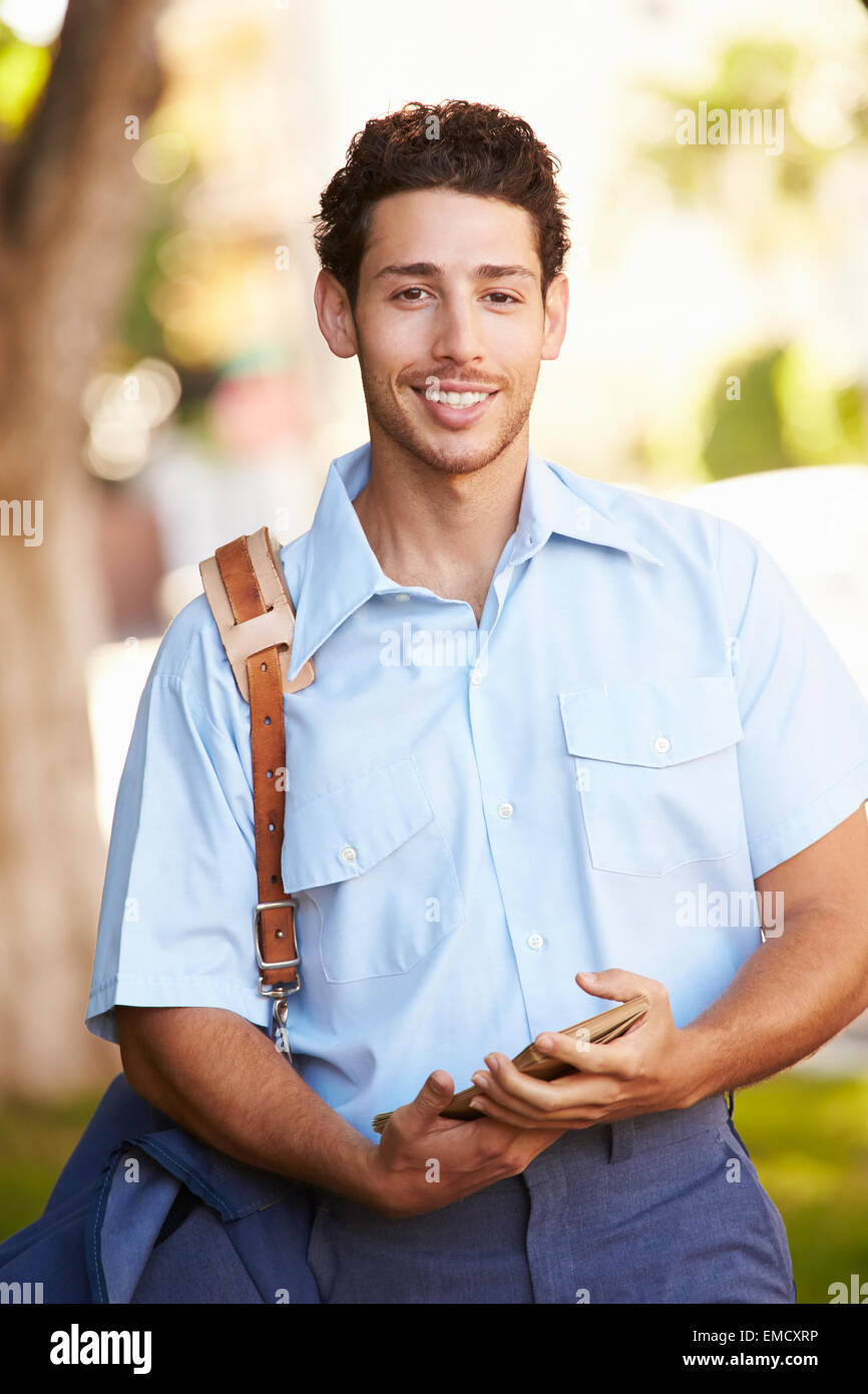 Mailman Walking Along Street Delivering Letters Stock Photo - Alamy