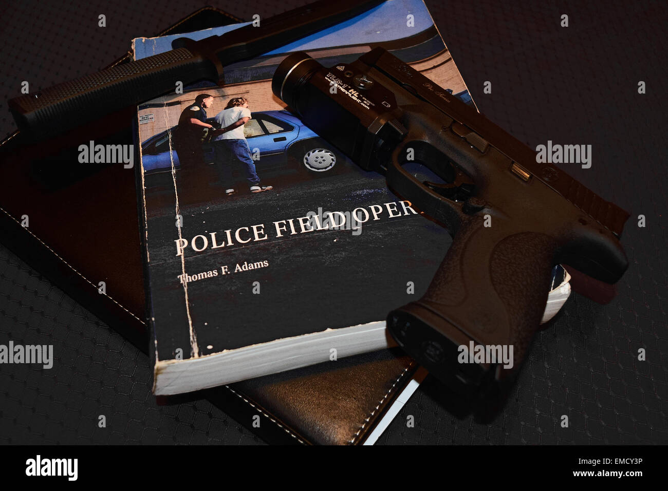 Police Field Operative book, training knife and pistol Stock Photo - Alamy