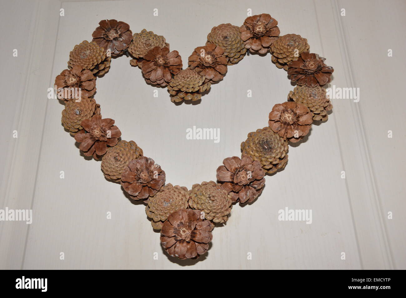 A handcraft heart of love made of little cones Stock Photo - Alamy