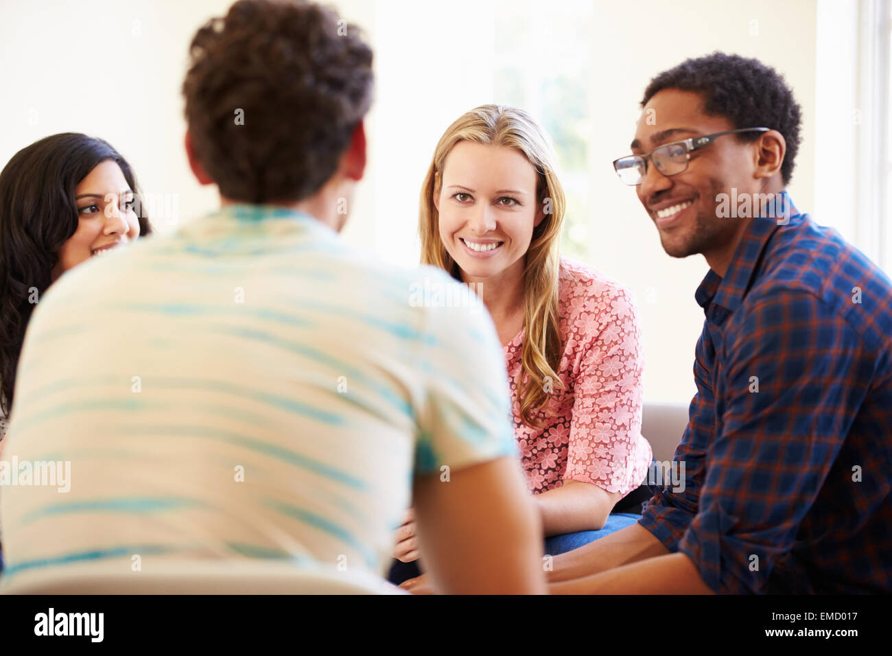 Group Of Business People Sitting On Chairs Having Meeting Stock Photo ...