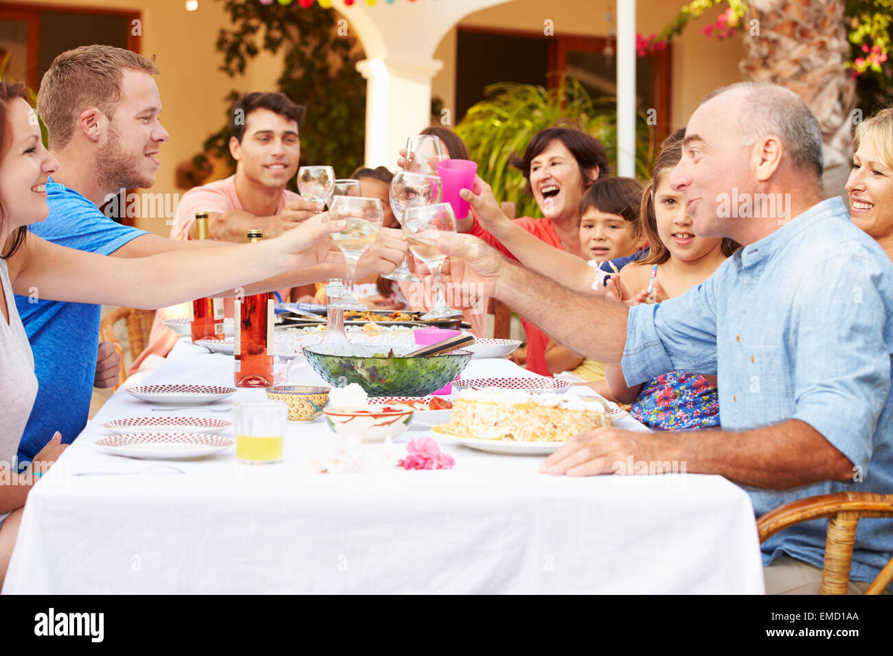 Large Family Group Celebrating Birthday On Terrace Together Stock Photo ...