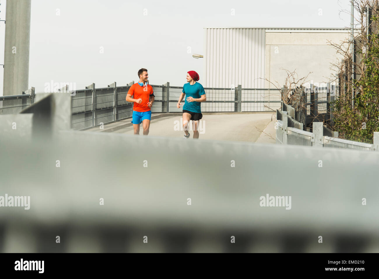 Two young men jogging on bridge Stock Photo - Alamy Two young men jogging on bridge Stock Photo - Alamy
