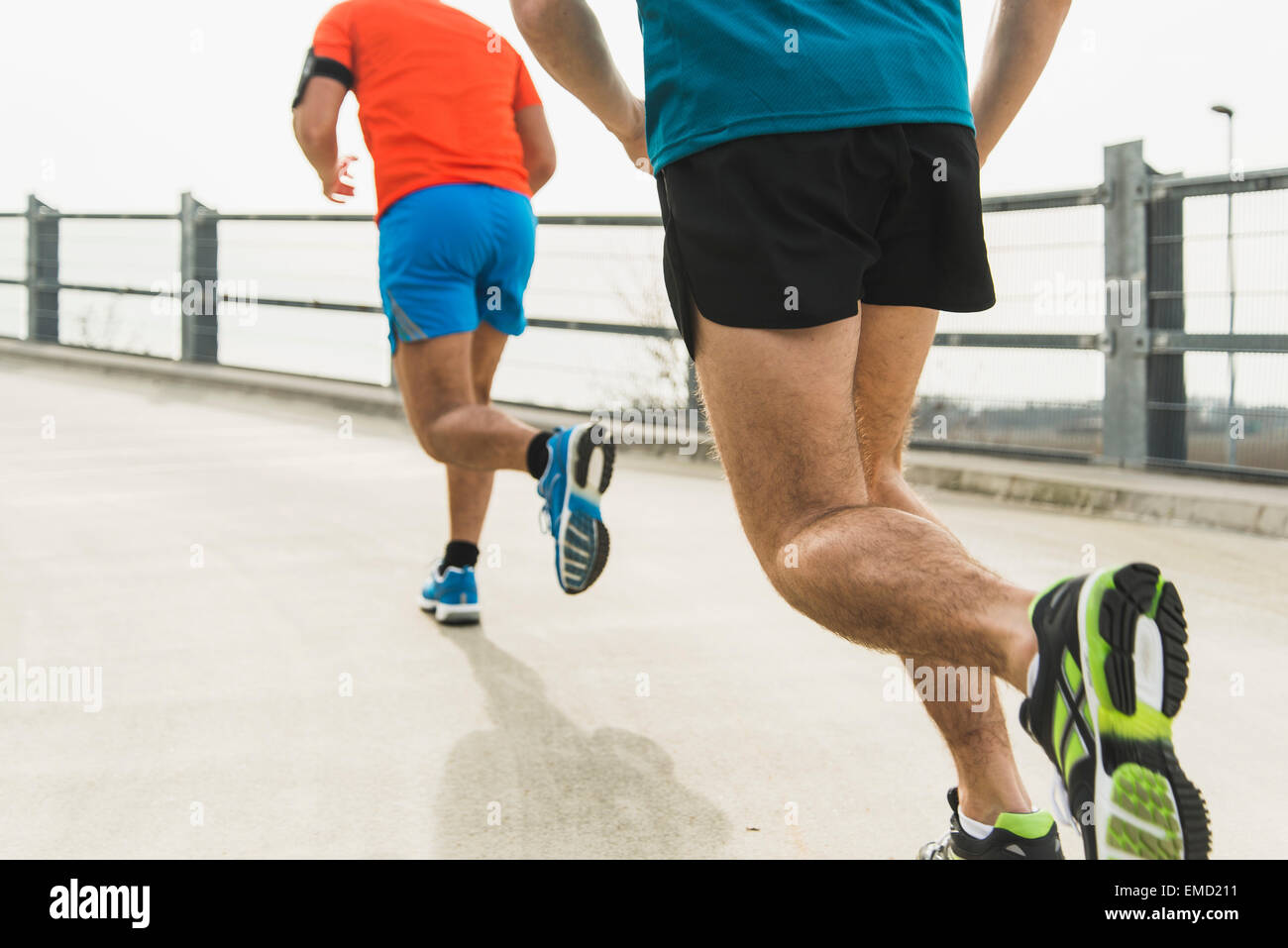 Two young men jogging on bridge Stock Photo - Alamy Two young men jogging on bridge Stock Photo - Alamy