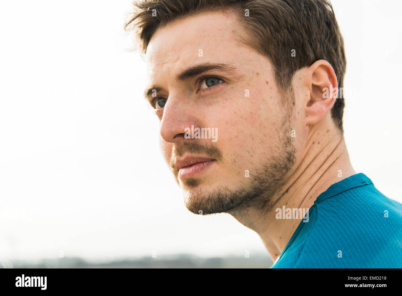 Thoughtful young man outdoors Stock Photo - Alamy