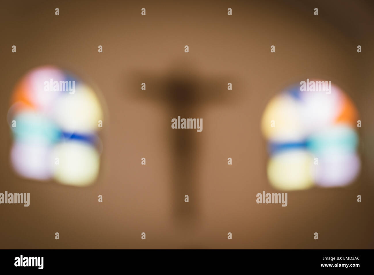 cross and stained glass window in the church blur abstract background ...