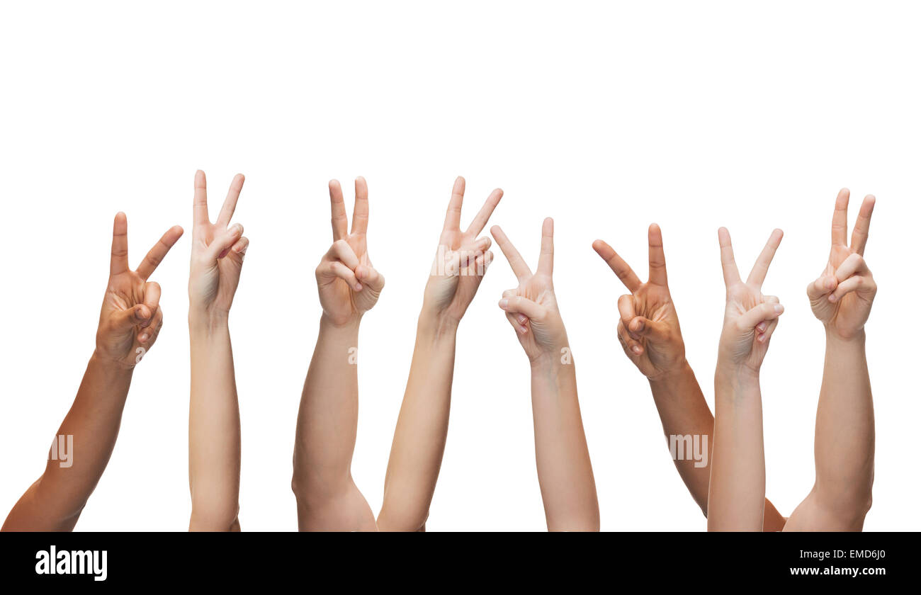 human hands showing v-sign Stock Photo - Alamy