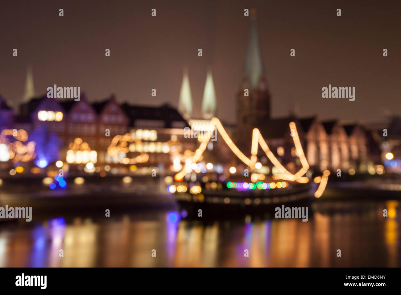 Germany, Bremen, blurred view to lighted historic old town at night ...
