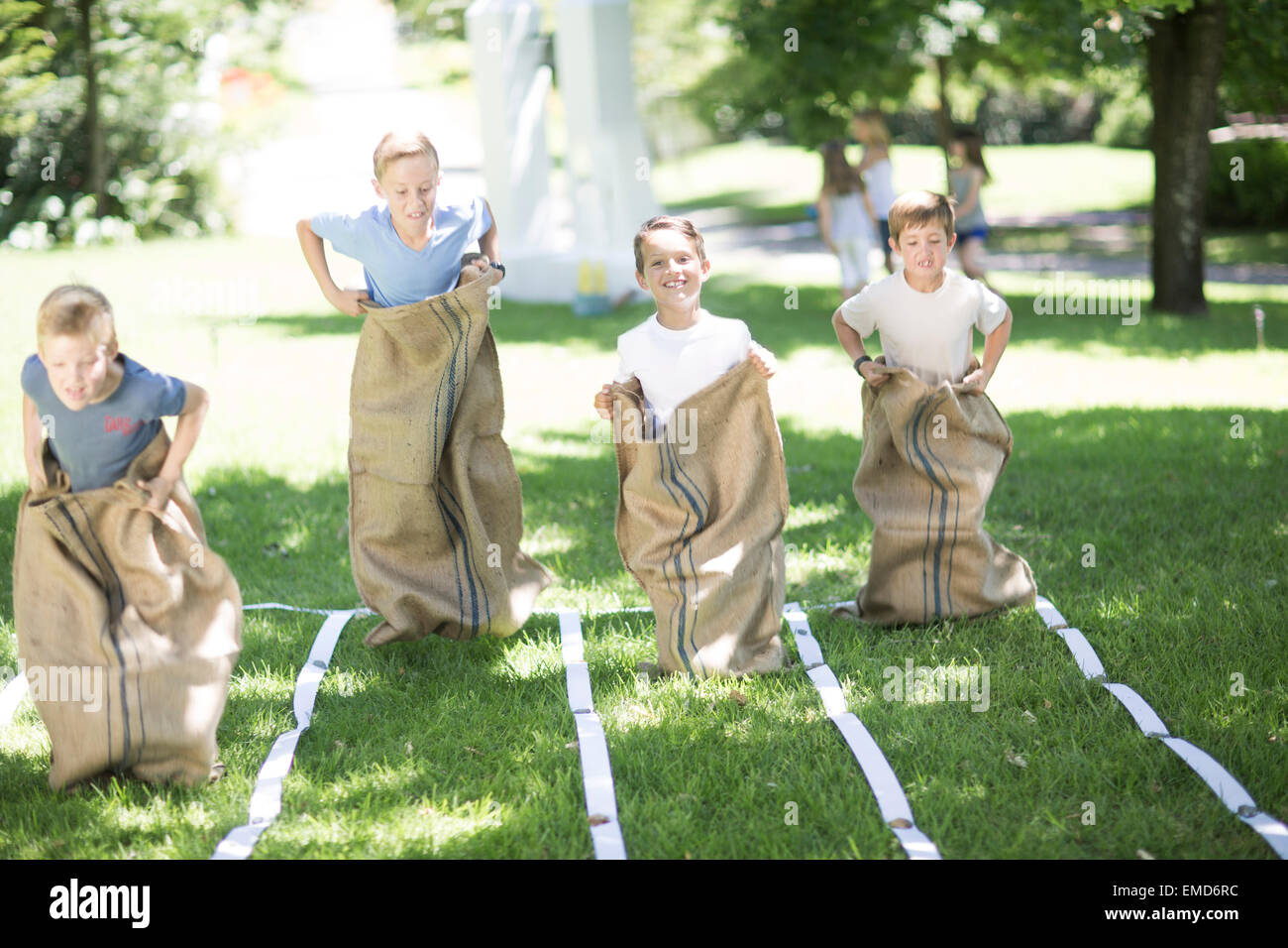 Boys competing in a sack race Stock Photo - Alamy