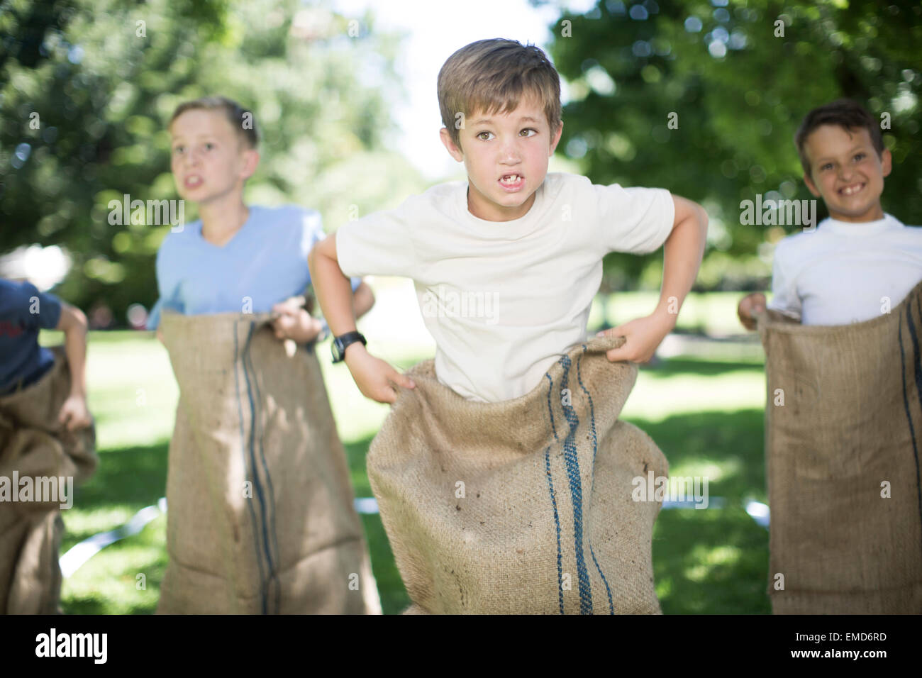 Boys competing in a sack race Stock Photo - Alamy