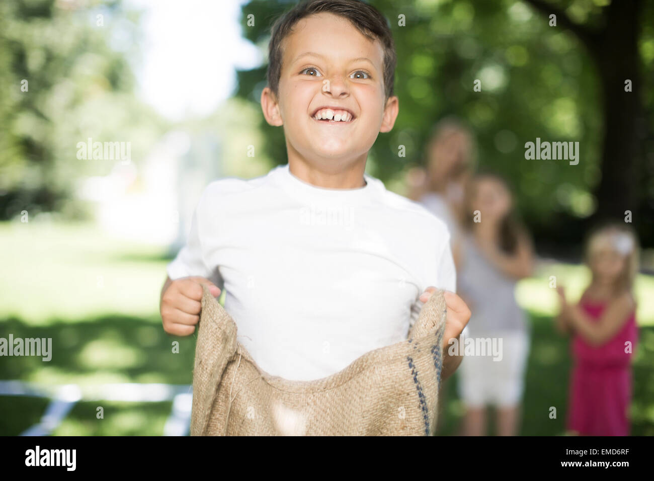 Boy competing in a sack race Stock Photo - Alamy