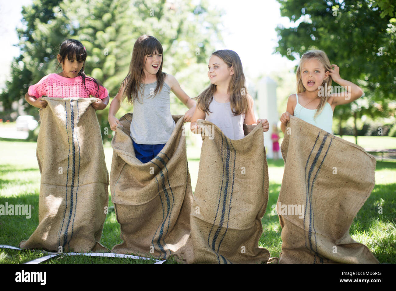 Girls competing in a sack race Stock Photo - Alamy