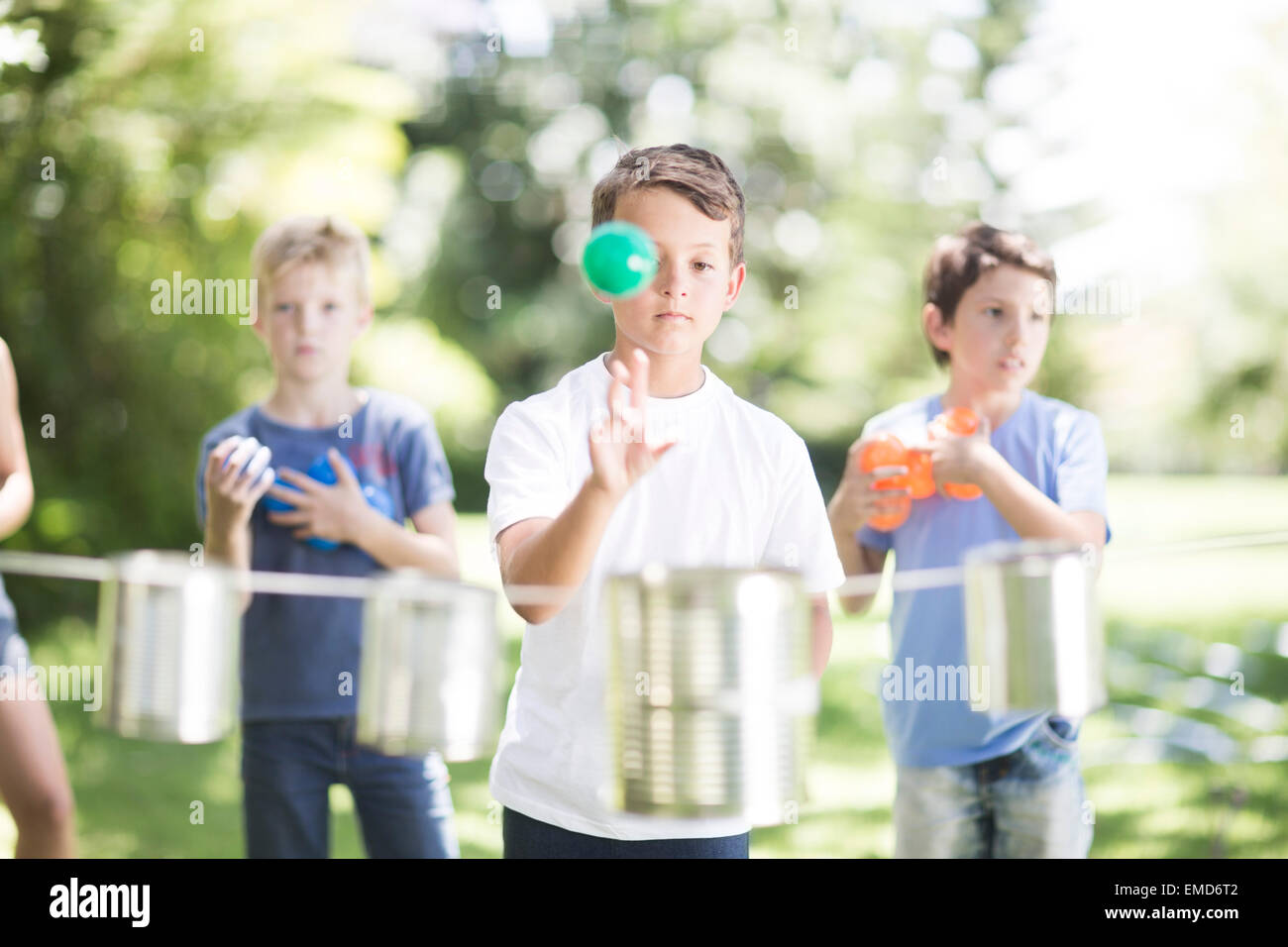 Boy girl playing tin can hi-res stock photography and images - Alamy