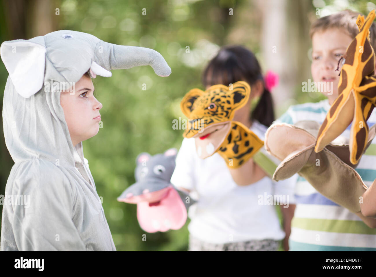 Kids playing wild animal dress-up Stock Photo - Alamy