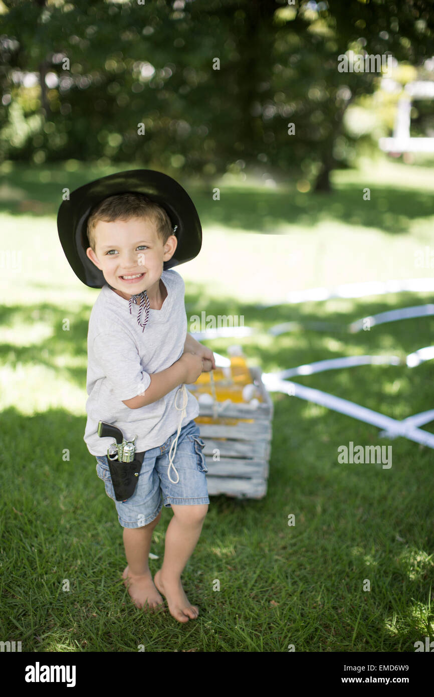 Boy pulling a crate of cool drinks Stock Photo - Alamy