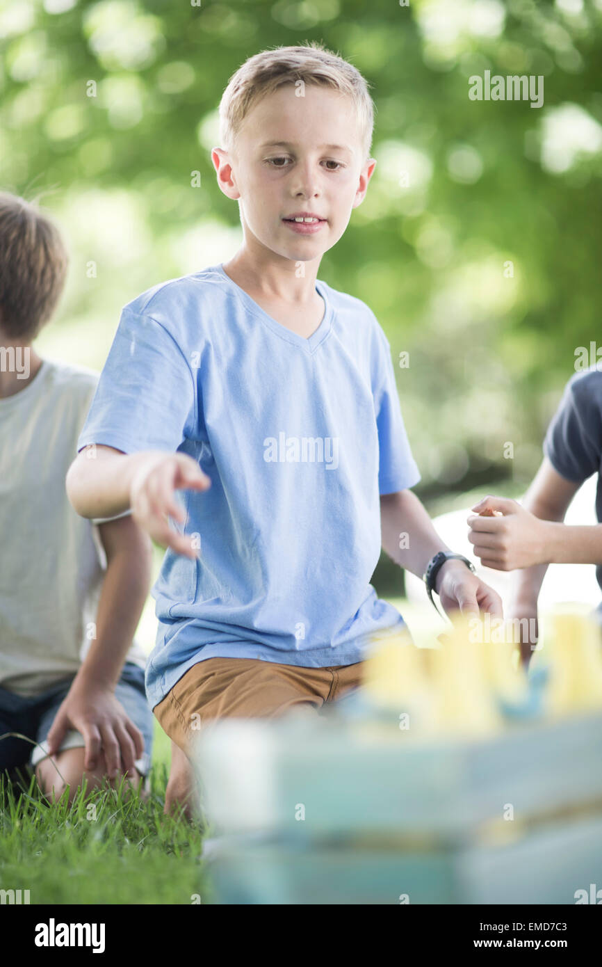 Boys in garden playing quoits Stock Photo - Alamy