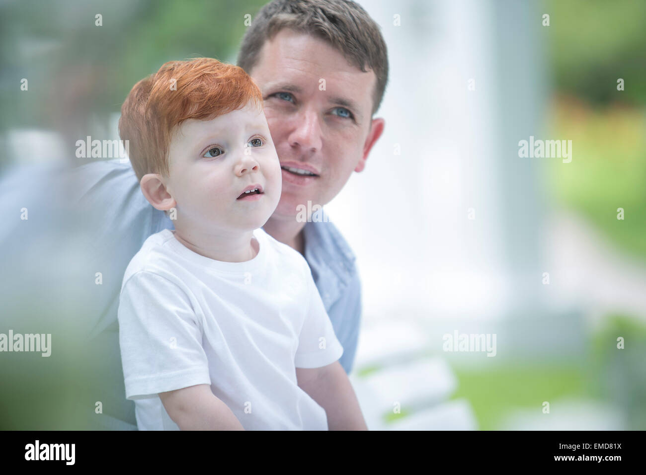 Red-haired boy with father outside Stock Photo - Alamy