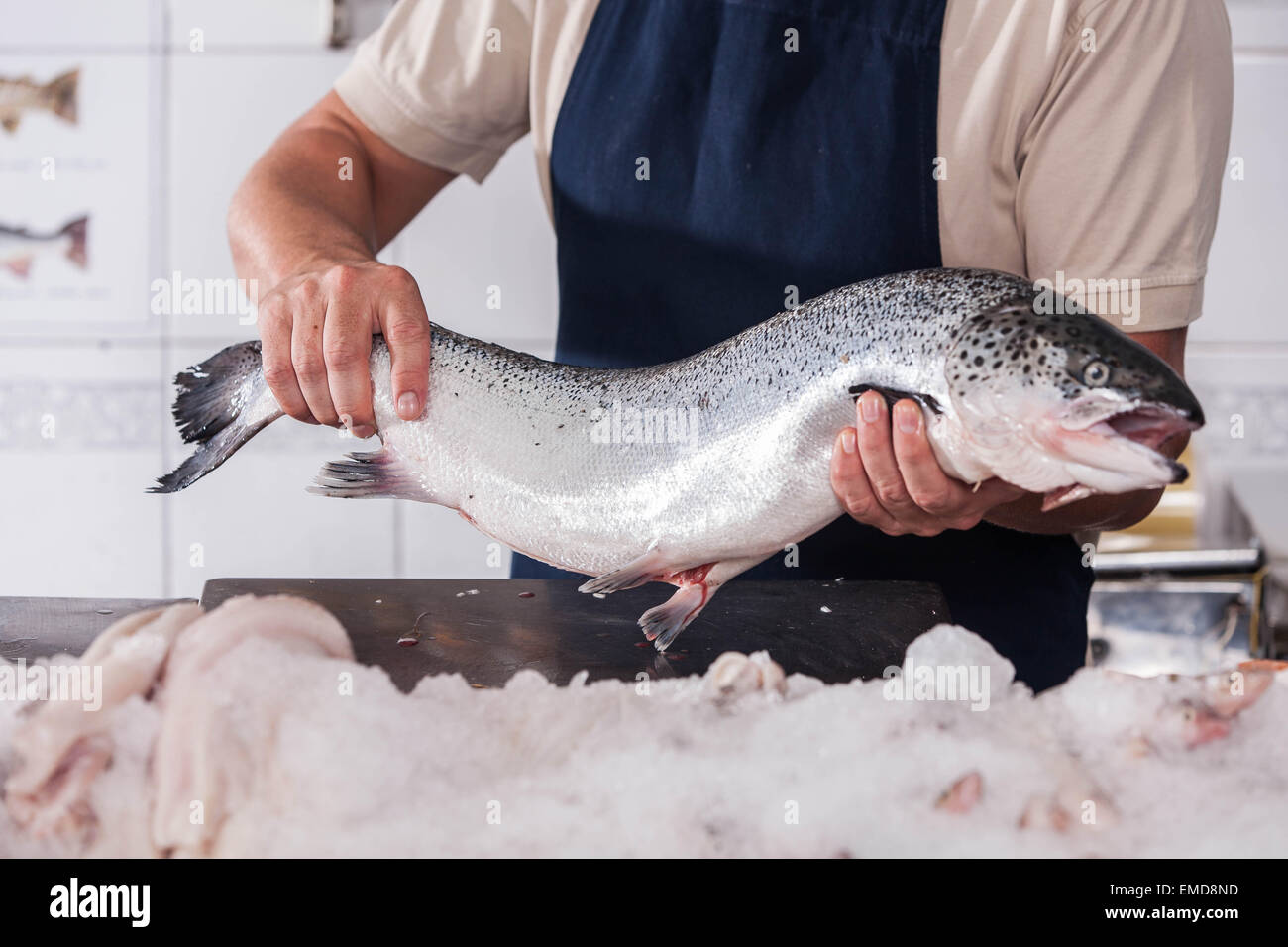 Seller man of a fish market Stock Photo - Alamy