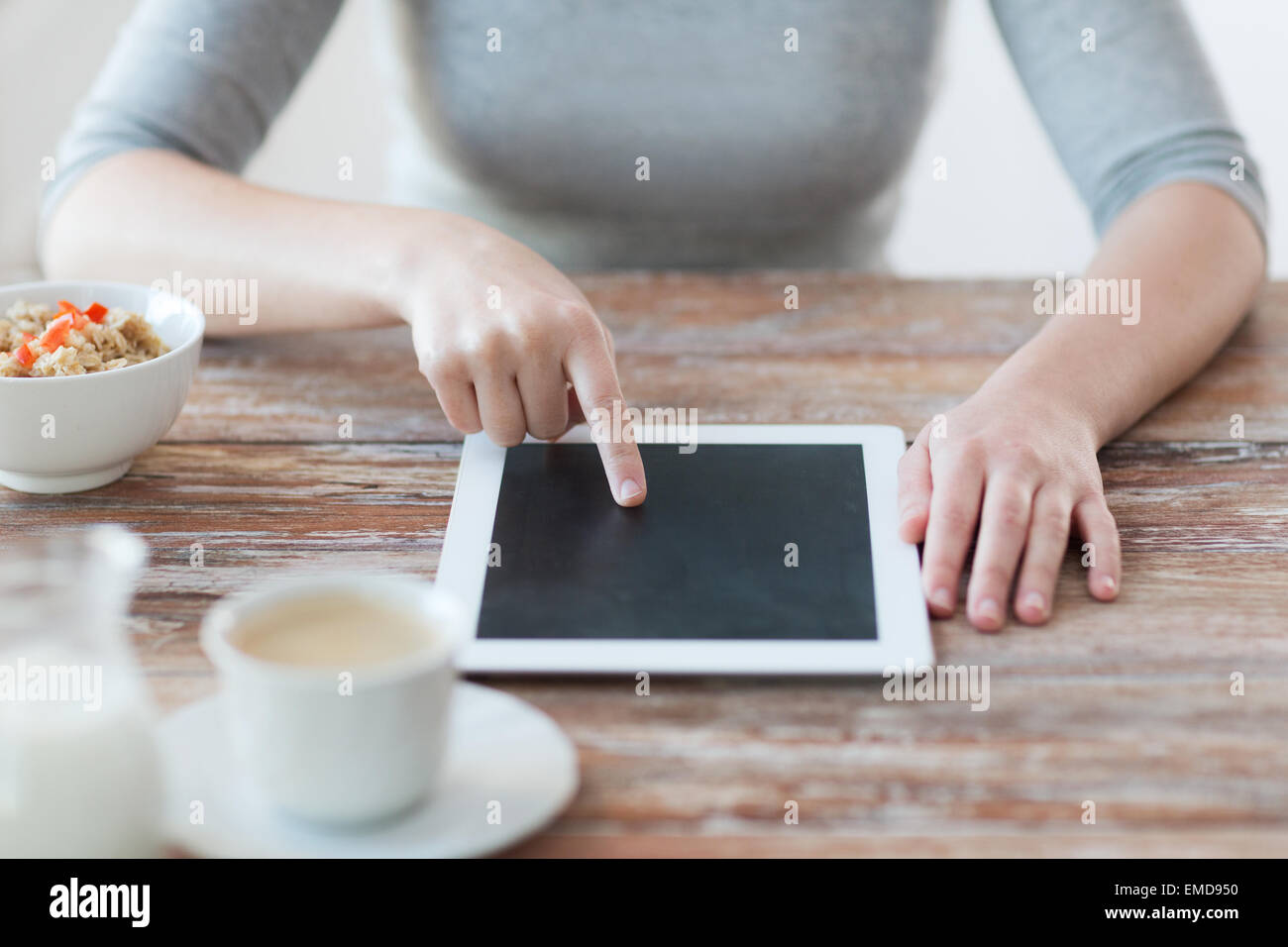 woman pointing finger to tablet pc computer Stock Photo - Alamy
