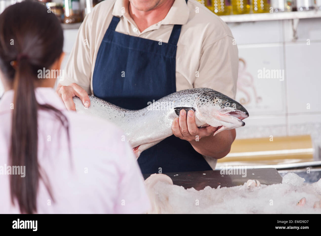 Old woman buying fish hi-res stock photography and images - Alamy