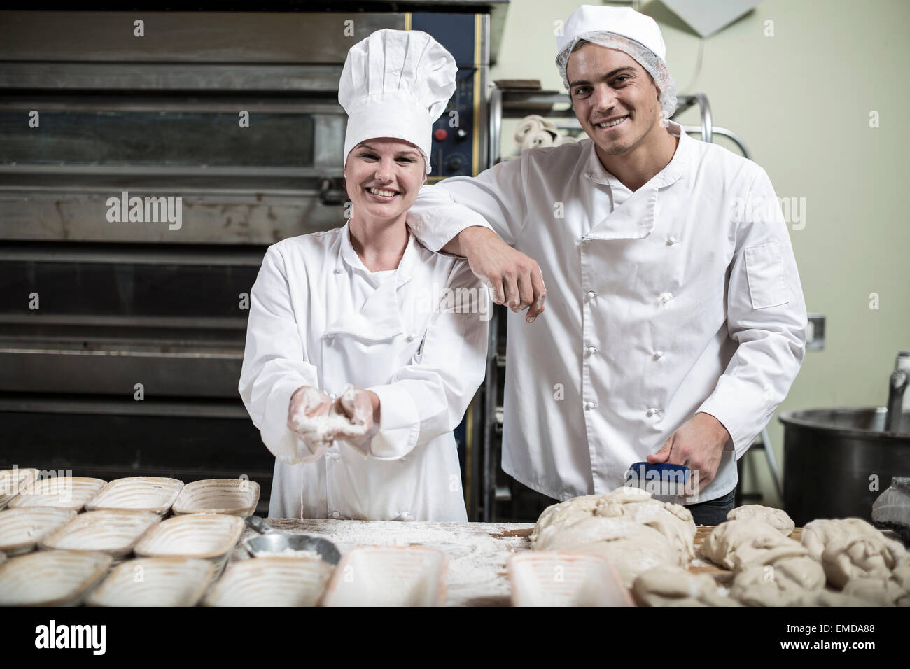 Portrait of two smiling bakers Stock Photo - Alamy