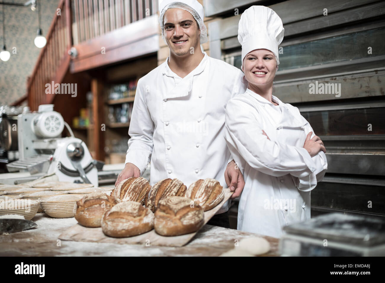 Two bakers and their fresh bread Stock Photo - Alamy