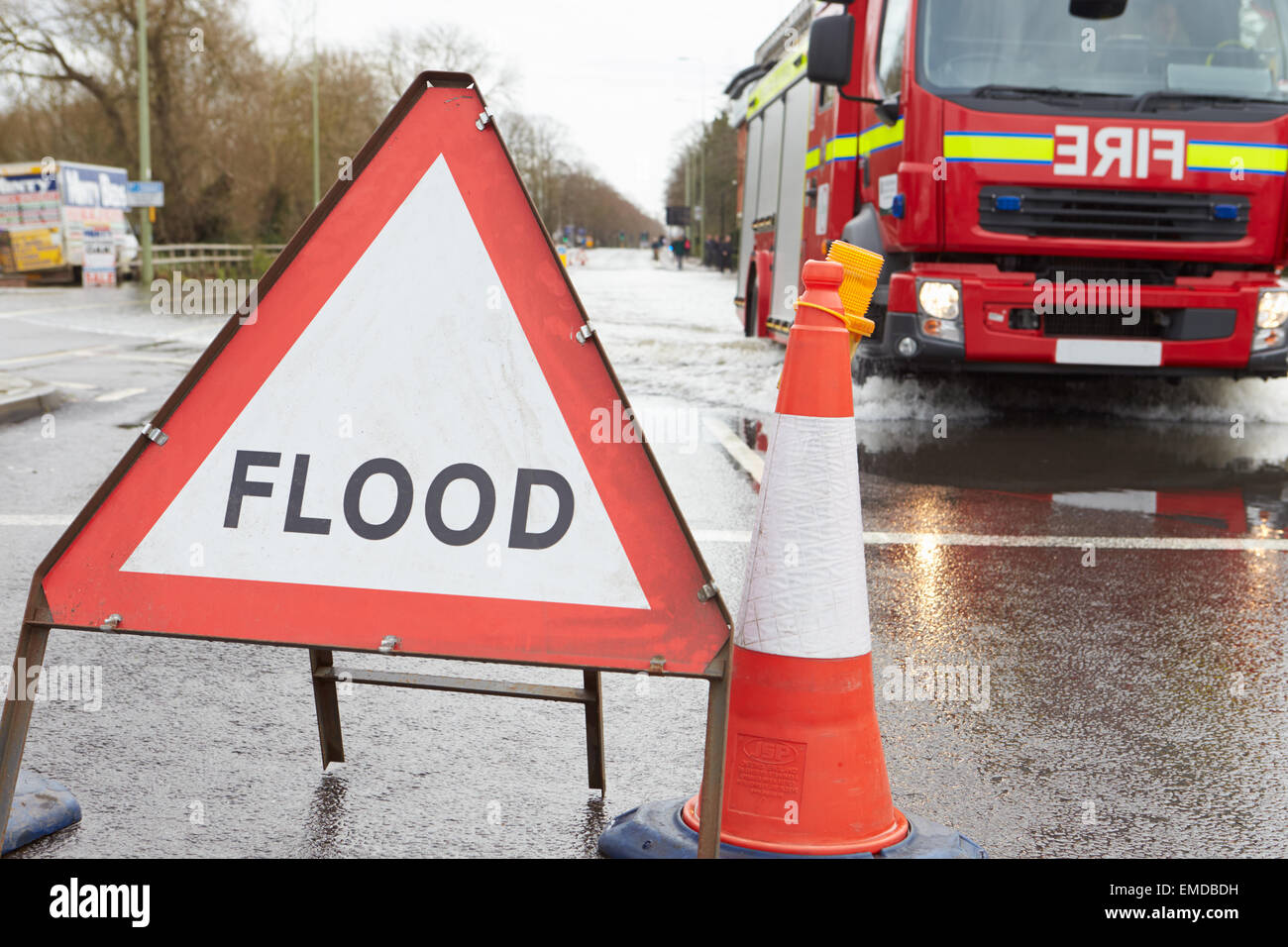 Warning Traffic Sign On Flooded Road With Fire Engine Stock Photo - Alamy