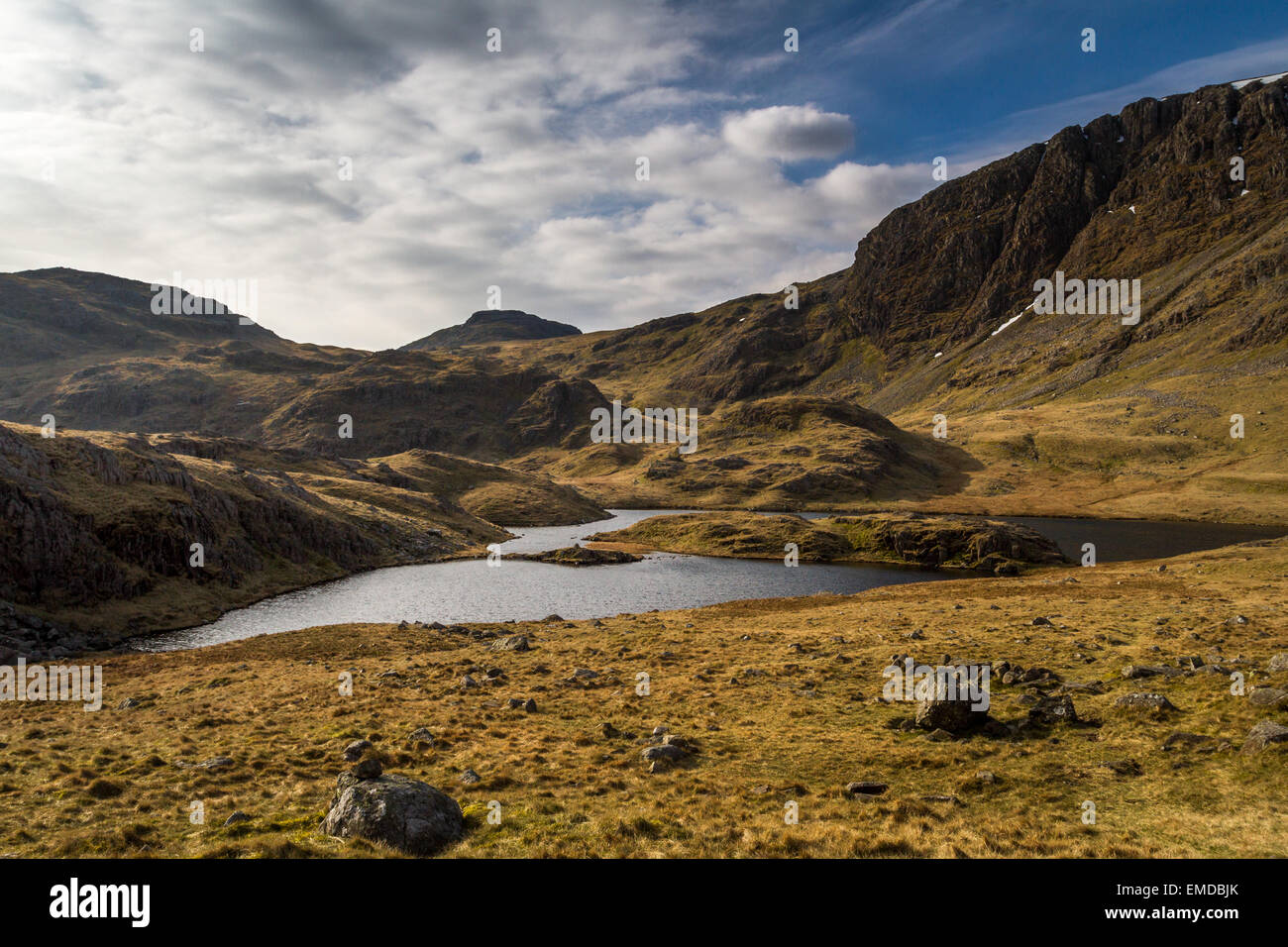Sprinkling tarn underneath Great End Stock Photo - Alamy
