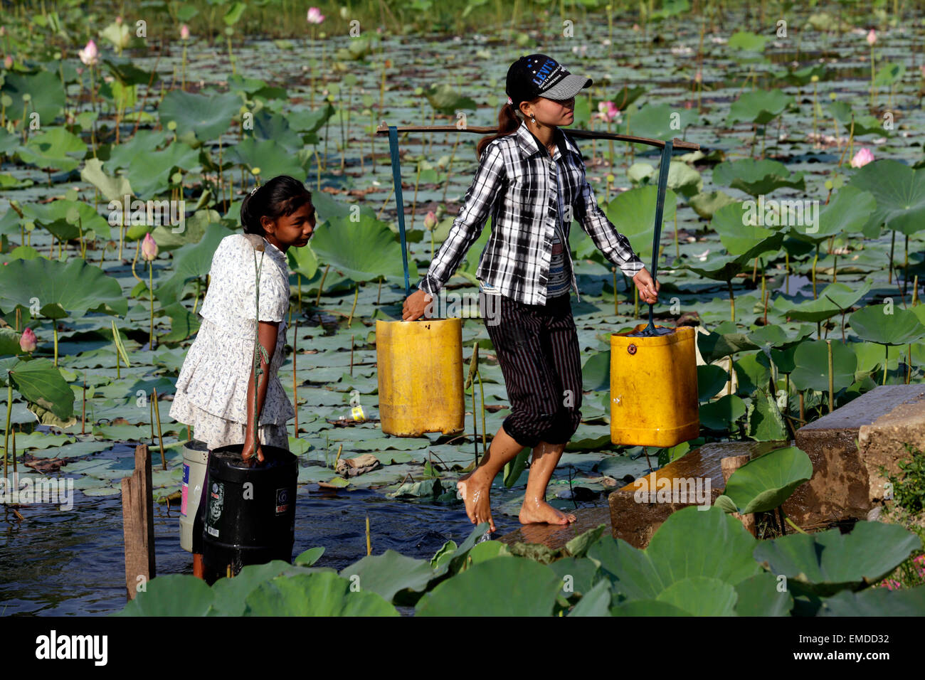 Yangon, Myanmar. 20th Apr, 2015. People fetch water from a lake at Dala ...