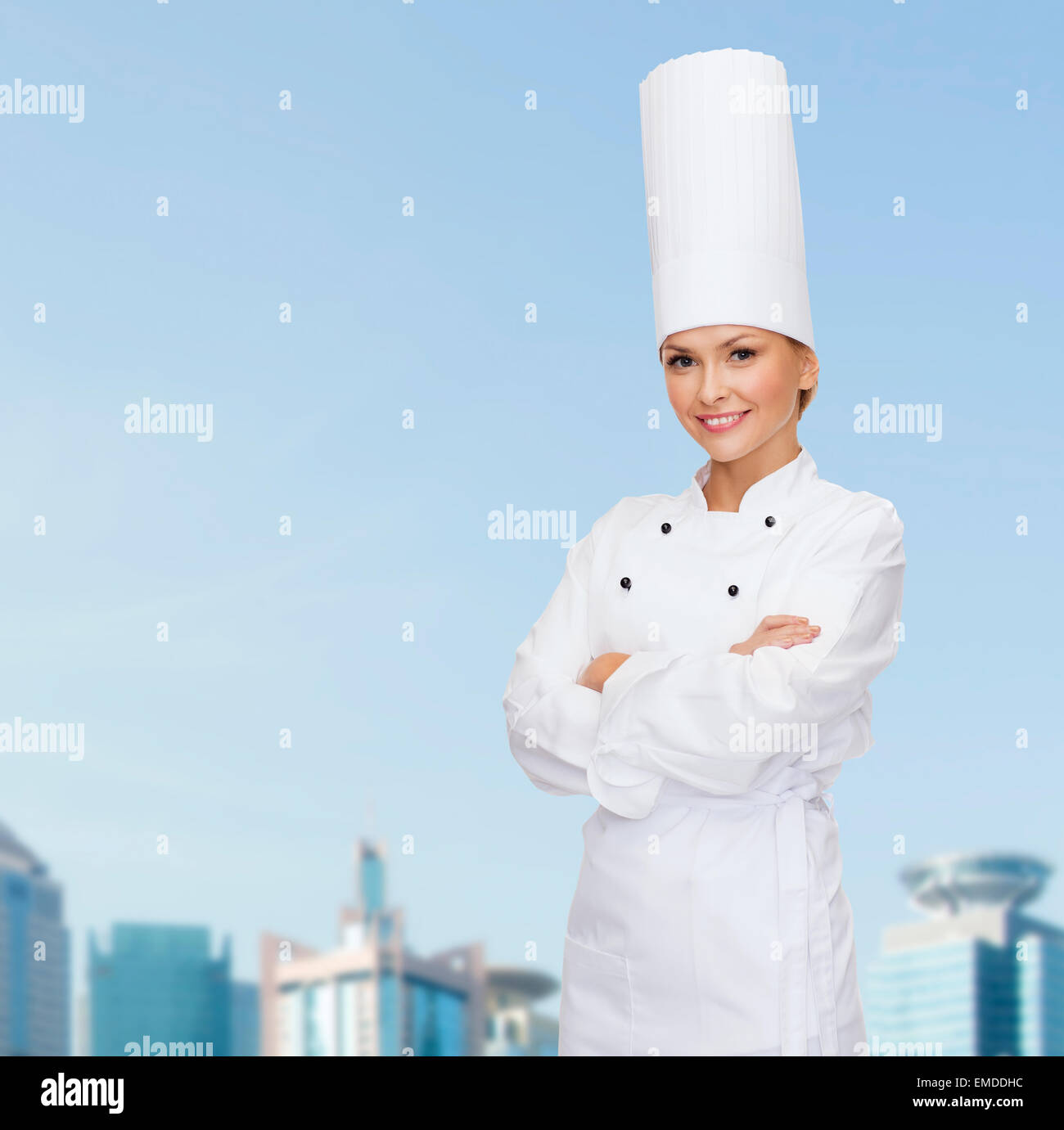 smiling female chef with crossed arms Stock Photo - Alamy