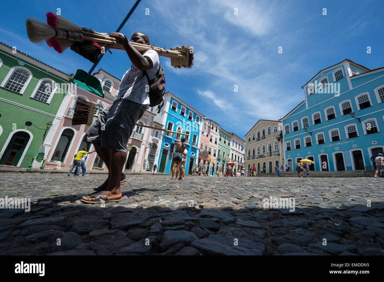 SALVADOR, BRAZIL - MARCH 12, 2015: Broom vendor passes in front of ...