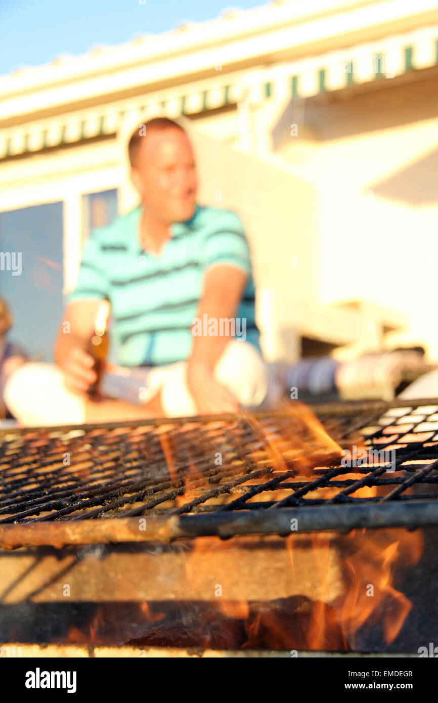 BBQ and blurred person Stock Photo - Alamy