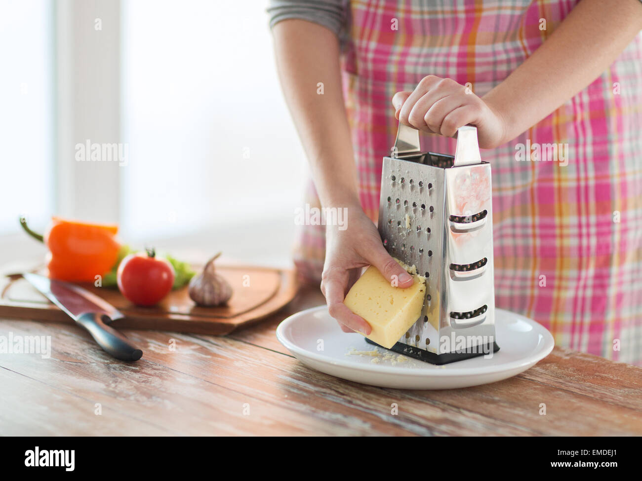 close up of female hands grating cheese Stock Photo - Alamy