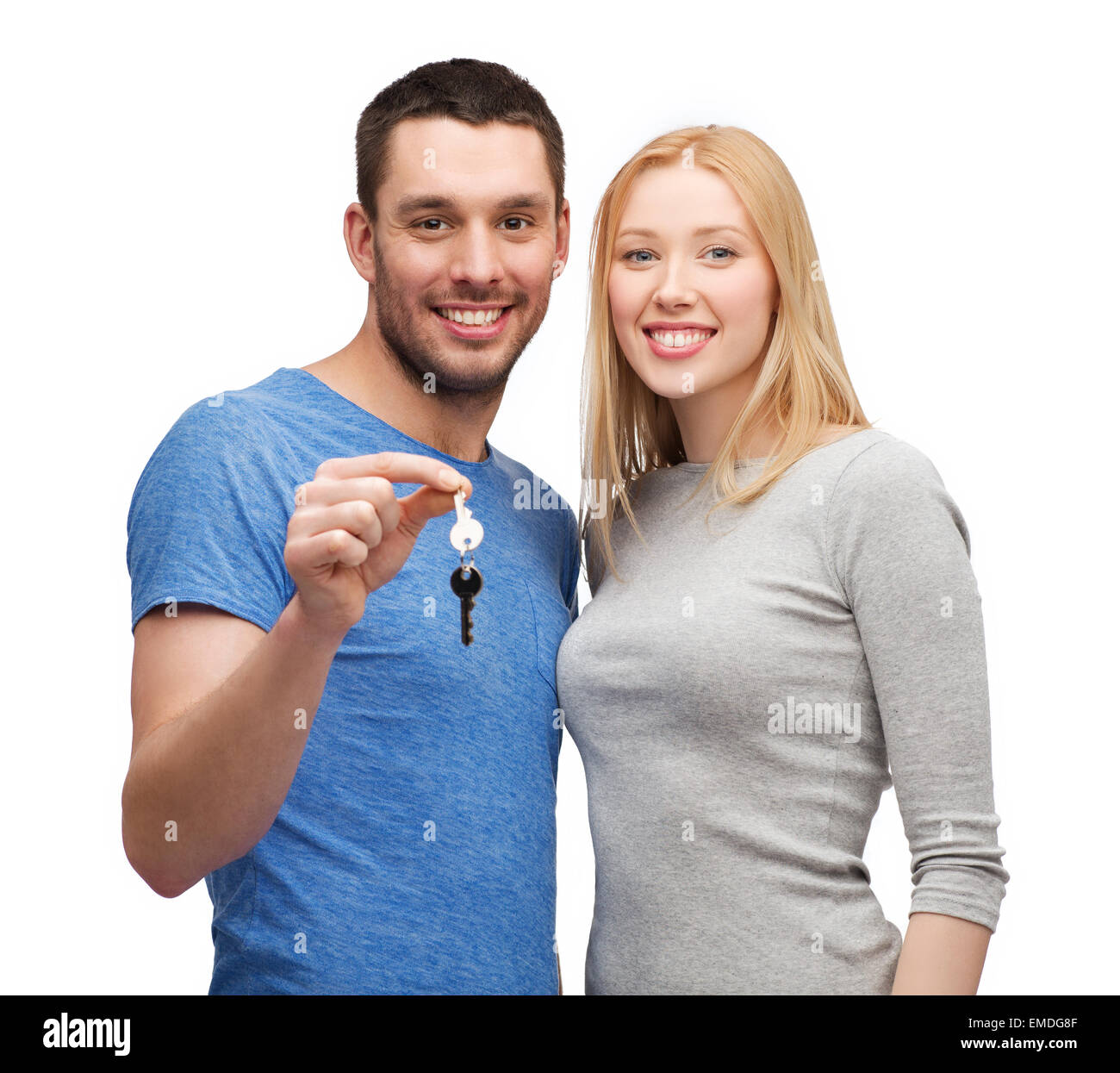 smiling couple holding keys Stock Photo - Alamy