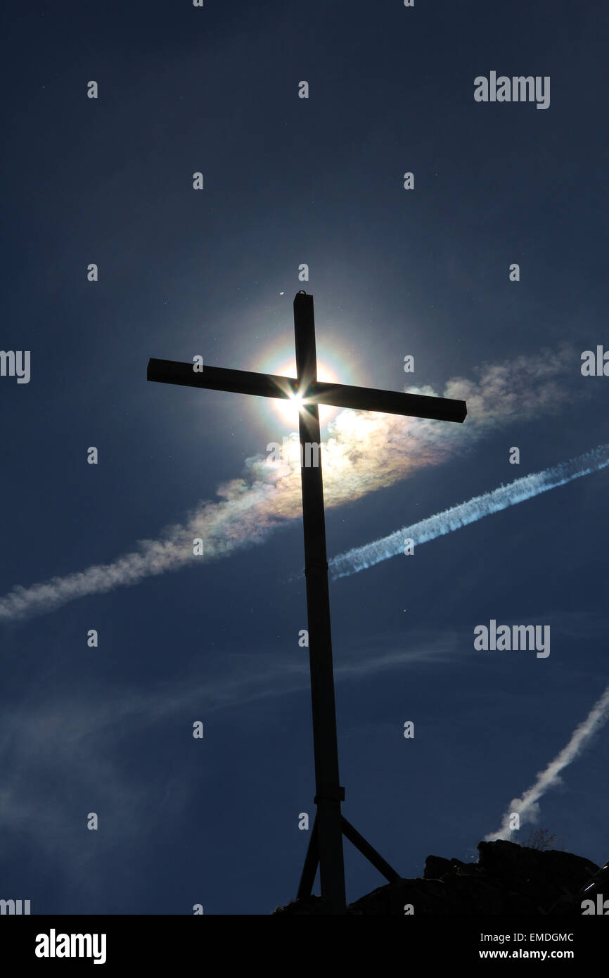 Cross with sun behind Stock Photo - Alamy