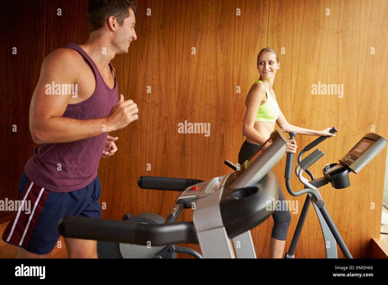 Couple Exercising Together In Home Gym Stock Photo - Alamy